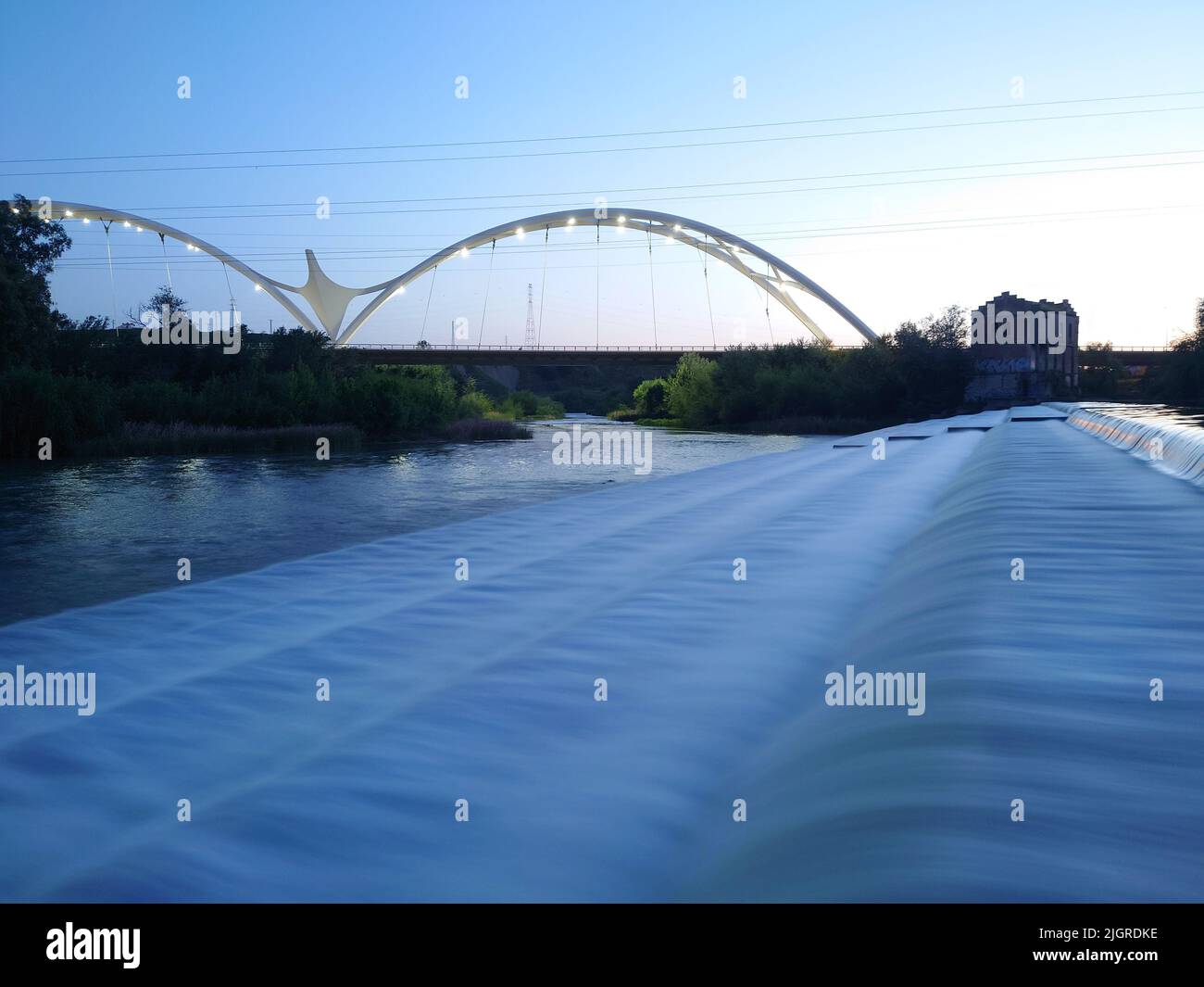 A breathtaking view from the river of Abbas ibn Firnas Bridge in Spain ...