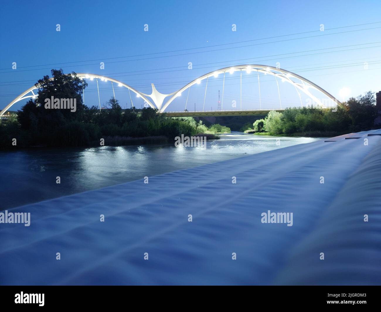 A breathtaking view from the river of Abbas ibn Firnas Bridge in Spain ...
