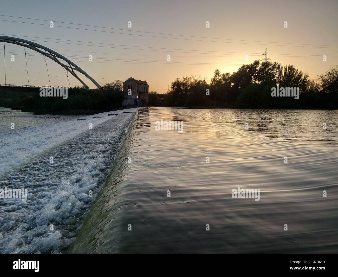 A breathtaking view from the river of Abbas ibn Firnas Bridge in Spain ...