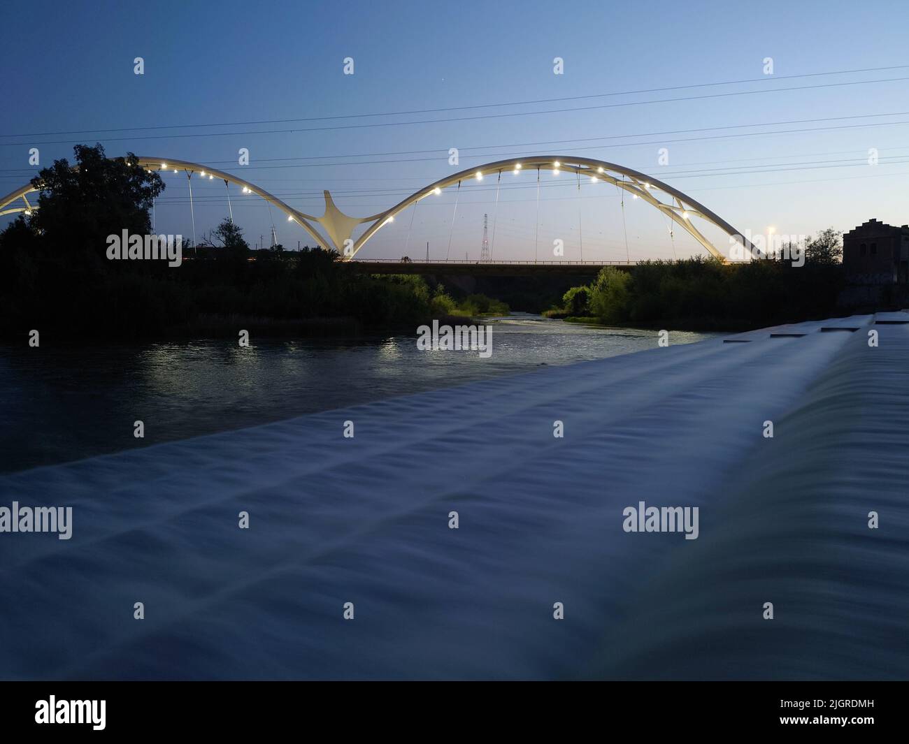 A breathtaking view from the river of Abbas ibn Firnas Bridge in Spain ...