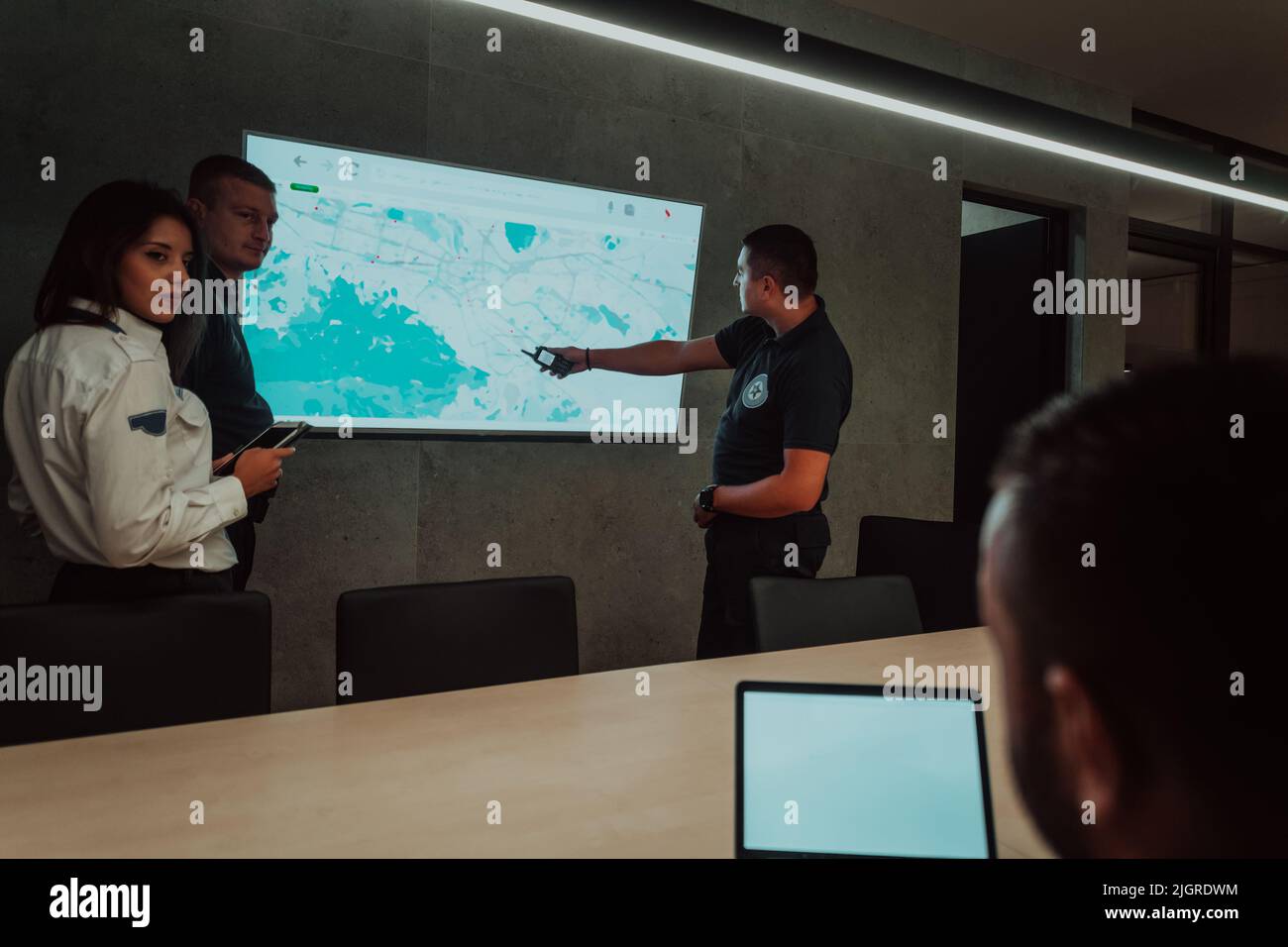 Group of Security data center operators working in a CCTV monitoring ...