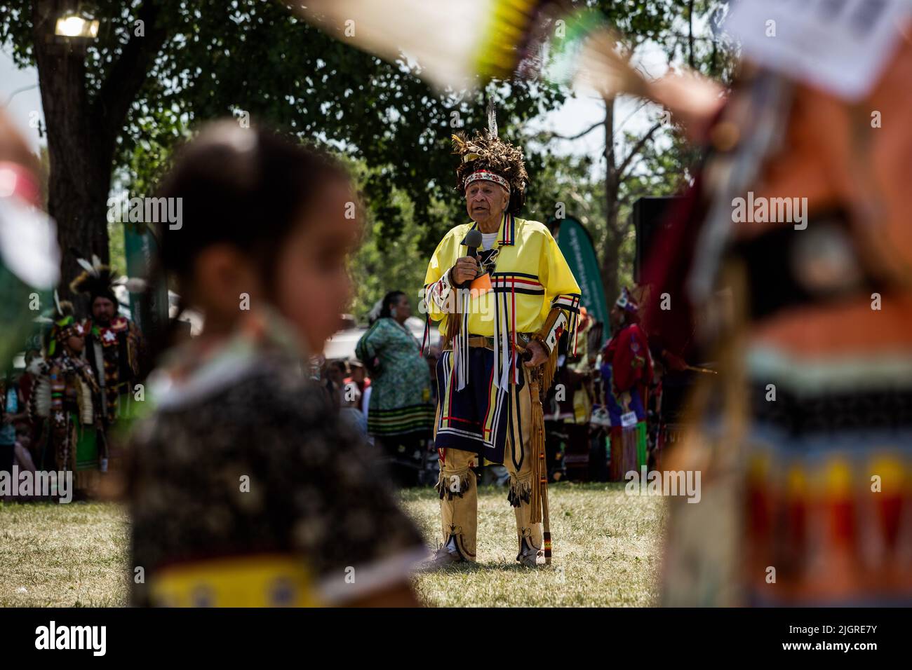 Kahnawake, Canada. 10th July, 2022. Children watching an elder making ...