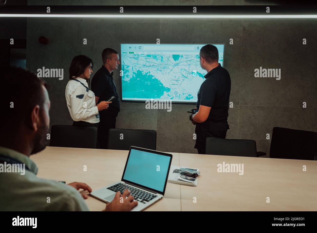 Group Of Security Data Center Operators Working In A Cctv Monitoring