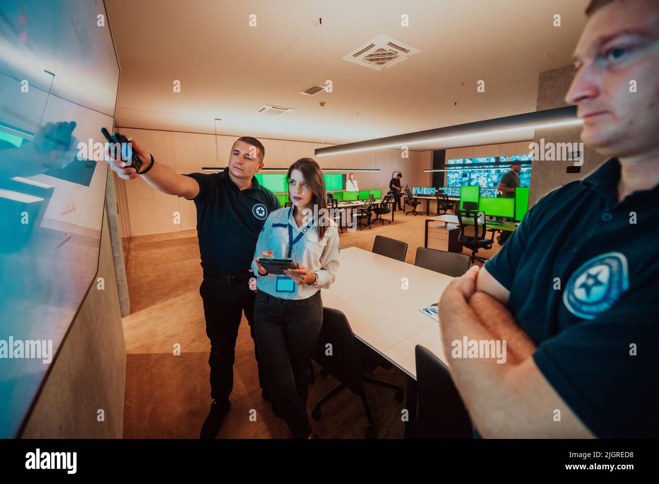 Group of Security data center operators working in a CCTV monitoring ...