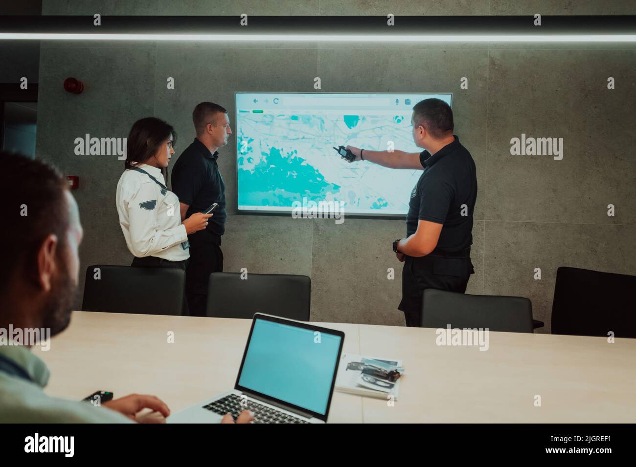 Group of Security data center operators working in a CCTV monitoring ...