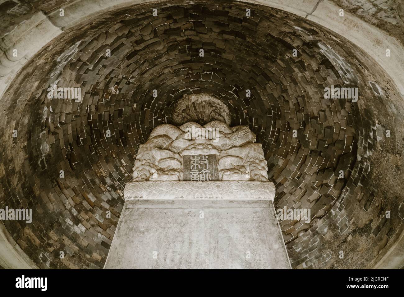 A low angle shot of carved sculptures inside TianYi Tomb (Eunuch tomb) in Beijing, China Stock ...
