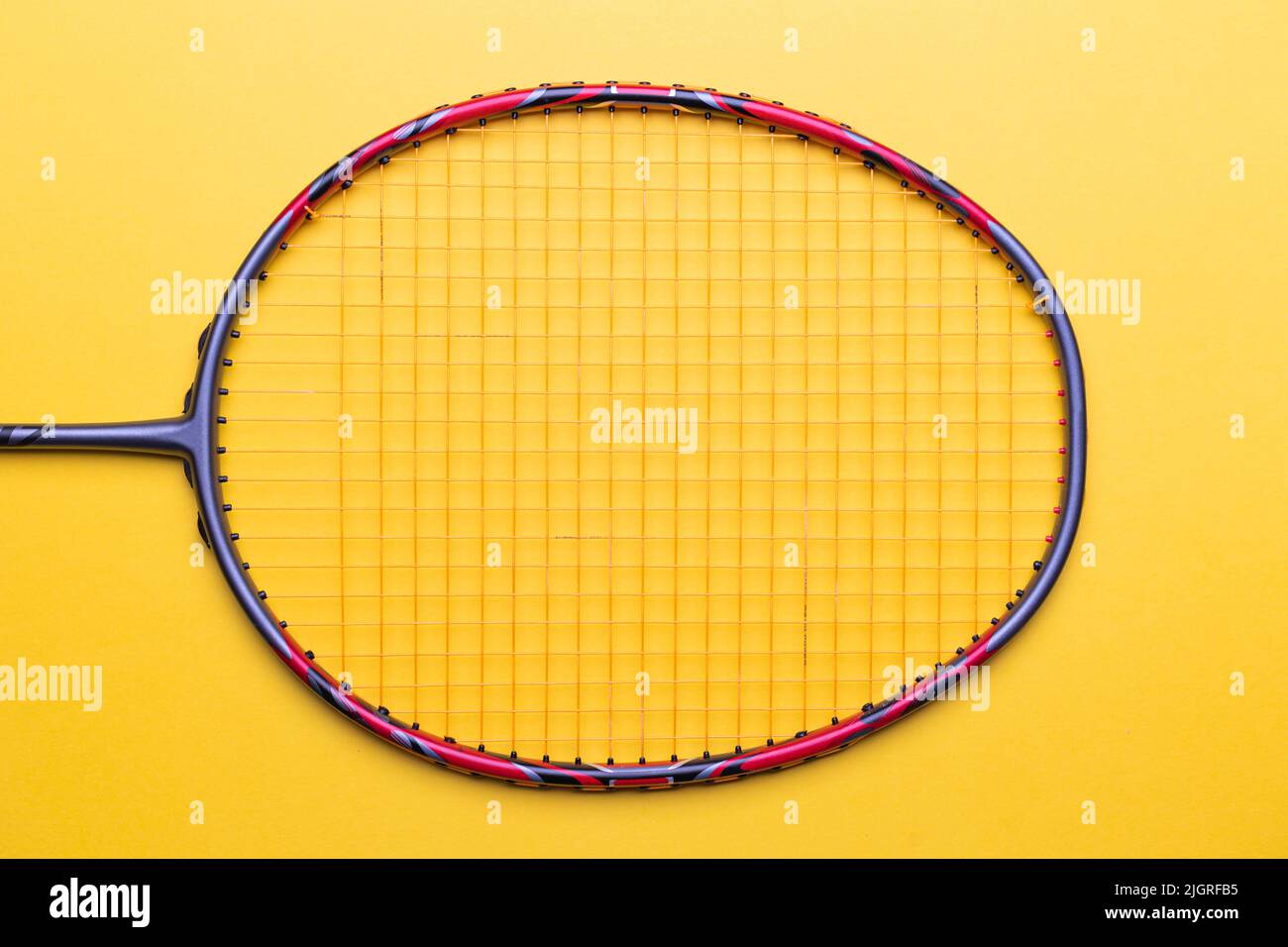 Badminton racket. Badminton racket on a yellow background and orange ...