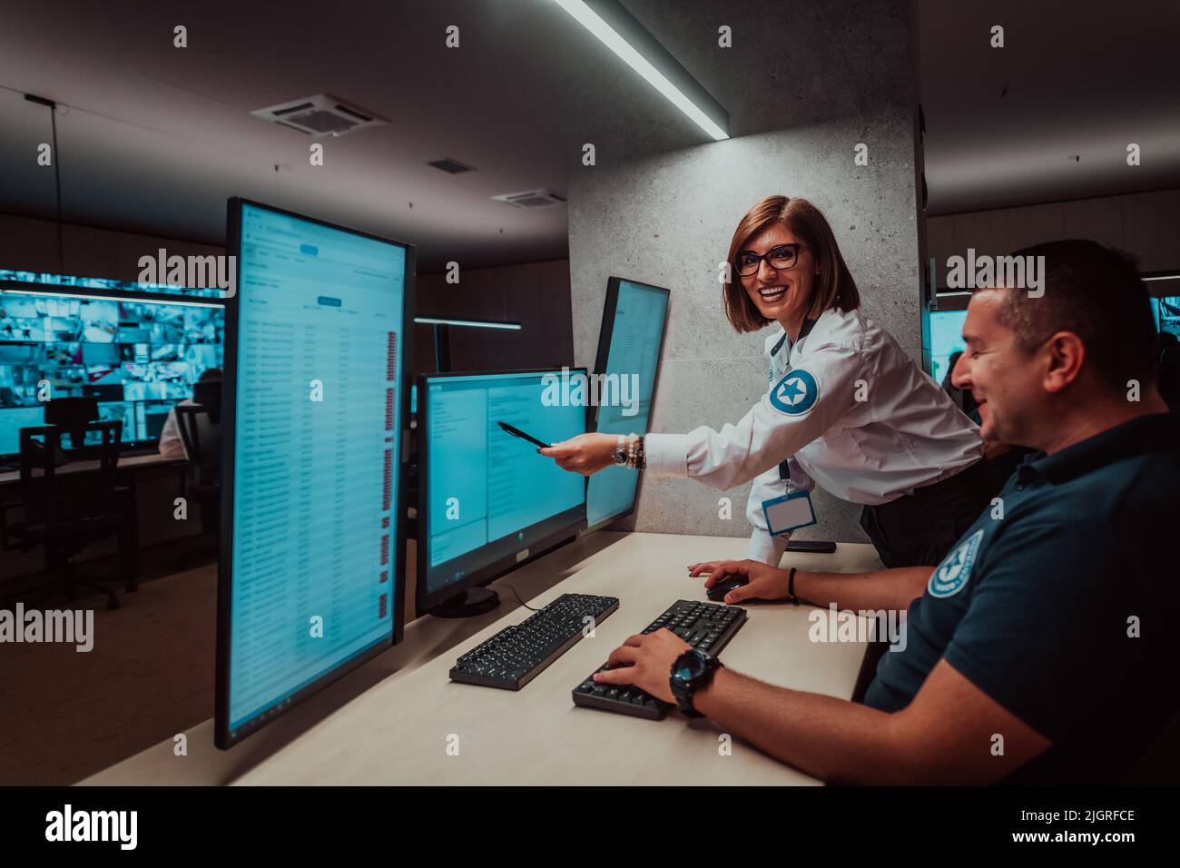 Group of Security data center operators working in a CCTV monitoring ...