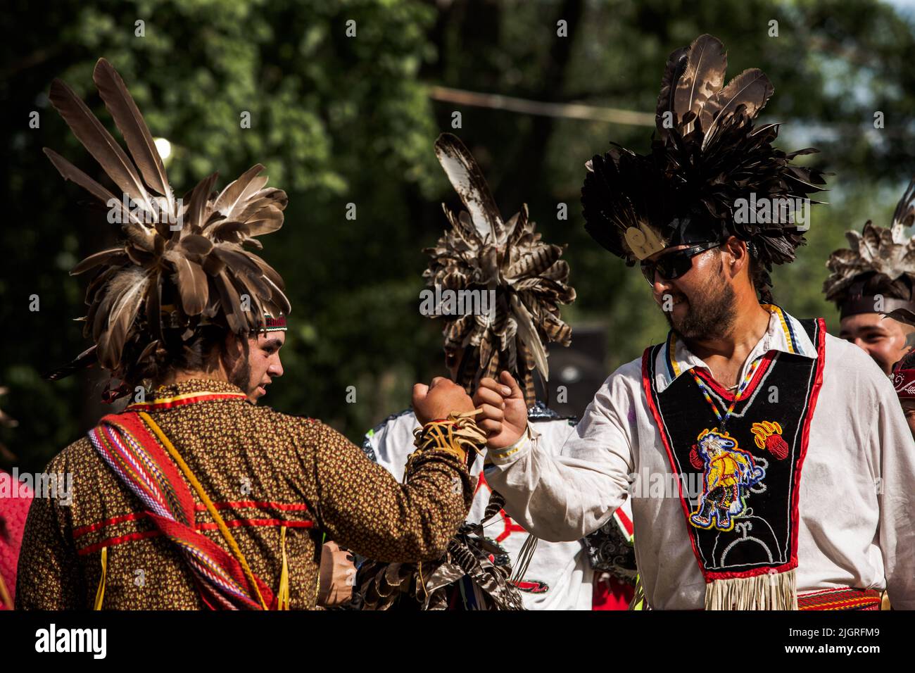 Kahnawake, Canada. 10th July, 2022. Pow-wow participants congratulate ...