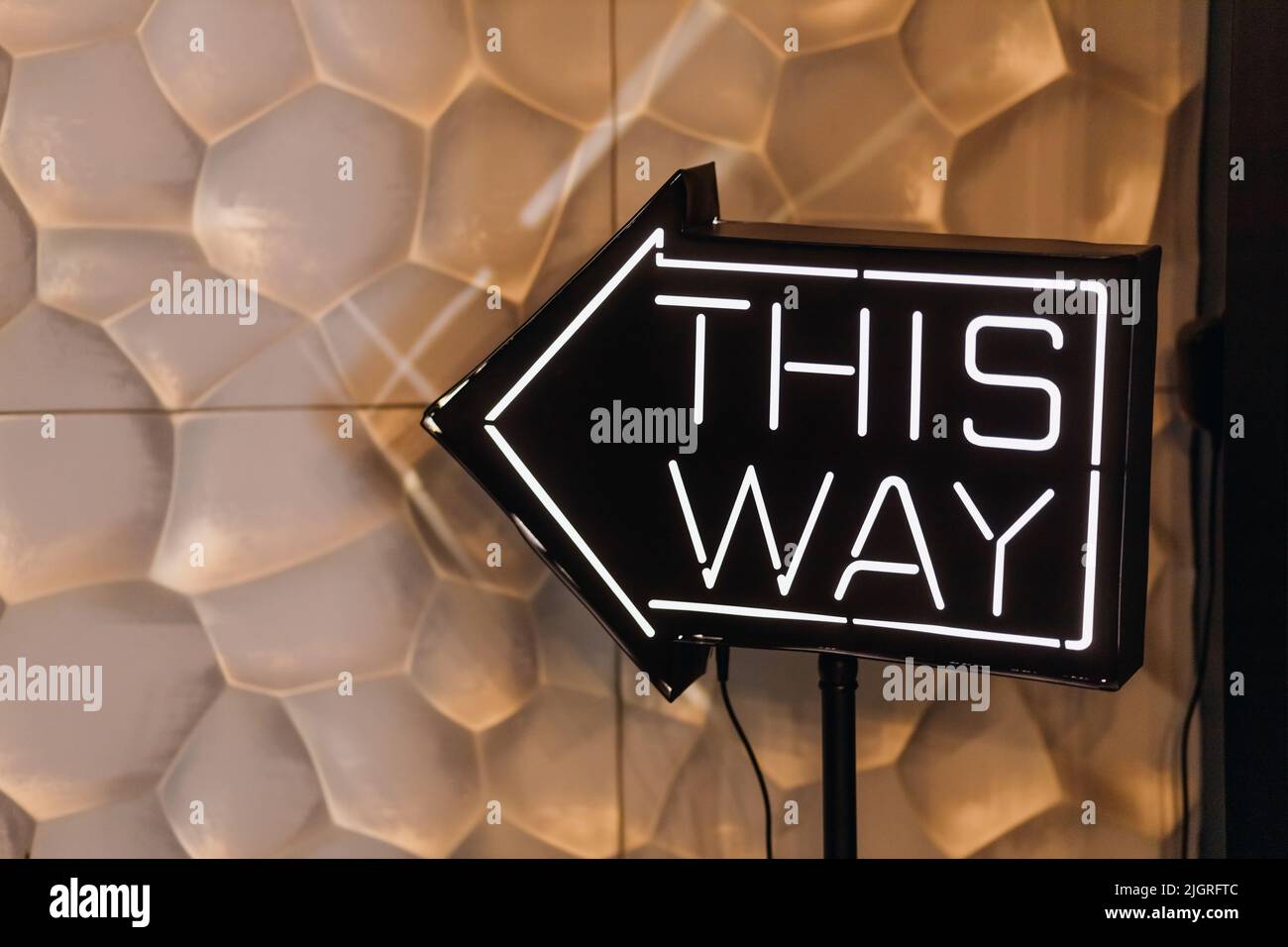 Direction in the institution. A sign with the inscription This way ...