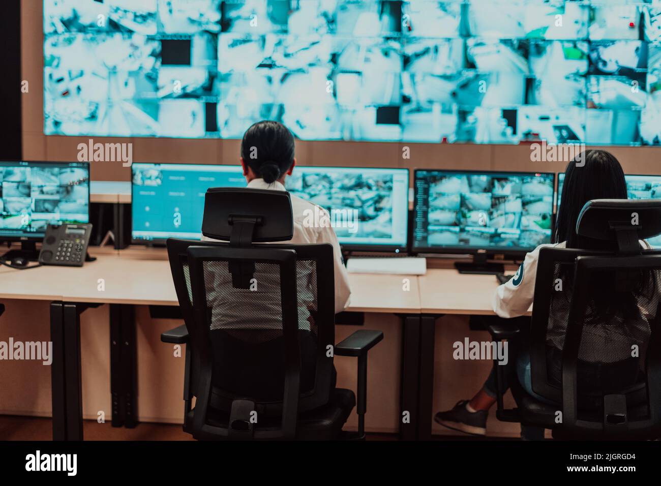 Group of Security data center operators working in a CCTV monitoring ...