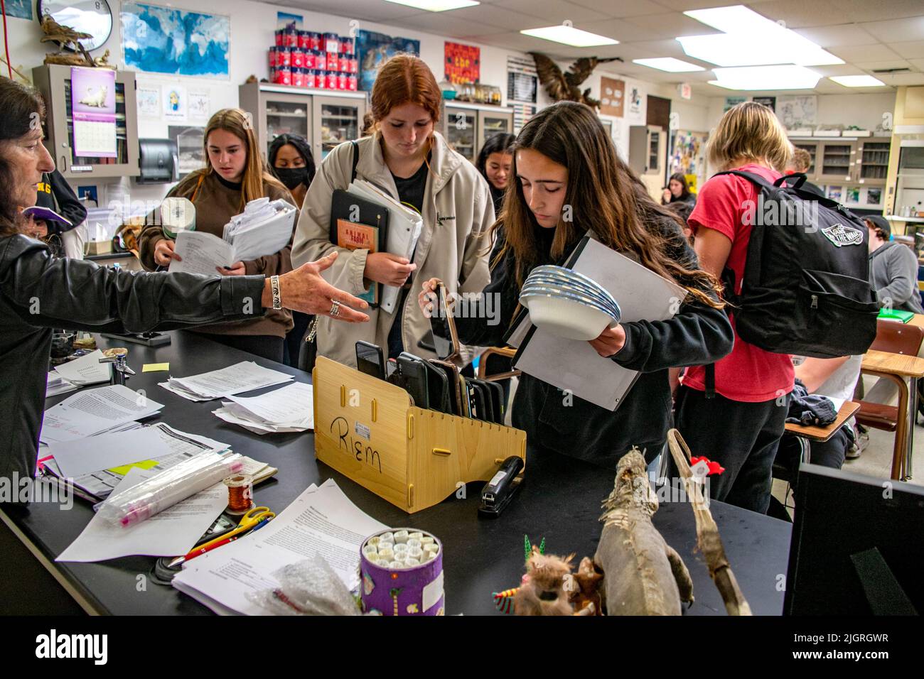 Students in a San Clemente, CA, high school chemistry class place their ...
