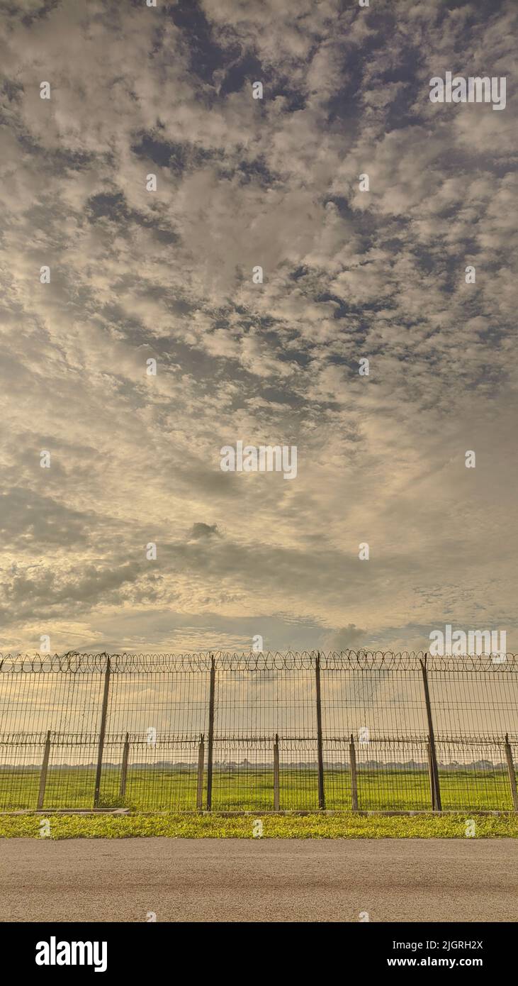 A beautiful shot of iron border fencing under the cloudy sky Stock ...