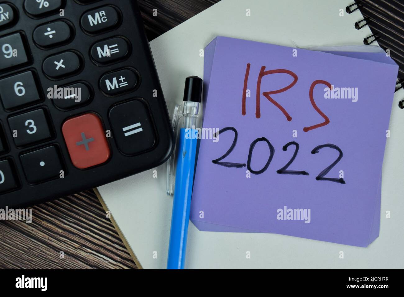 Concept of IRS 2022 write on sticky notes isolated on Wooden Table ...