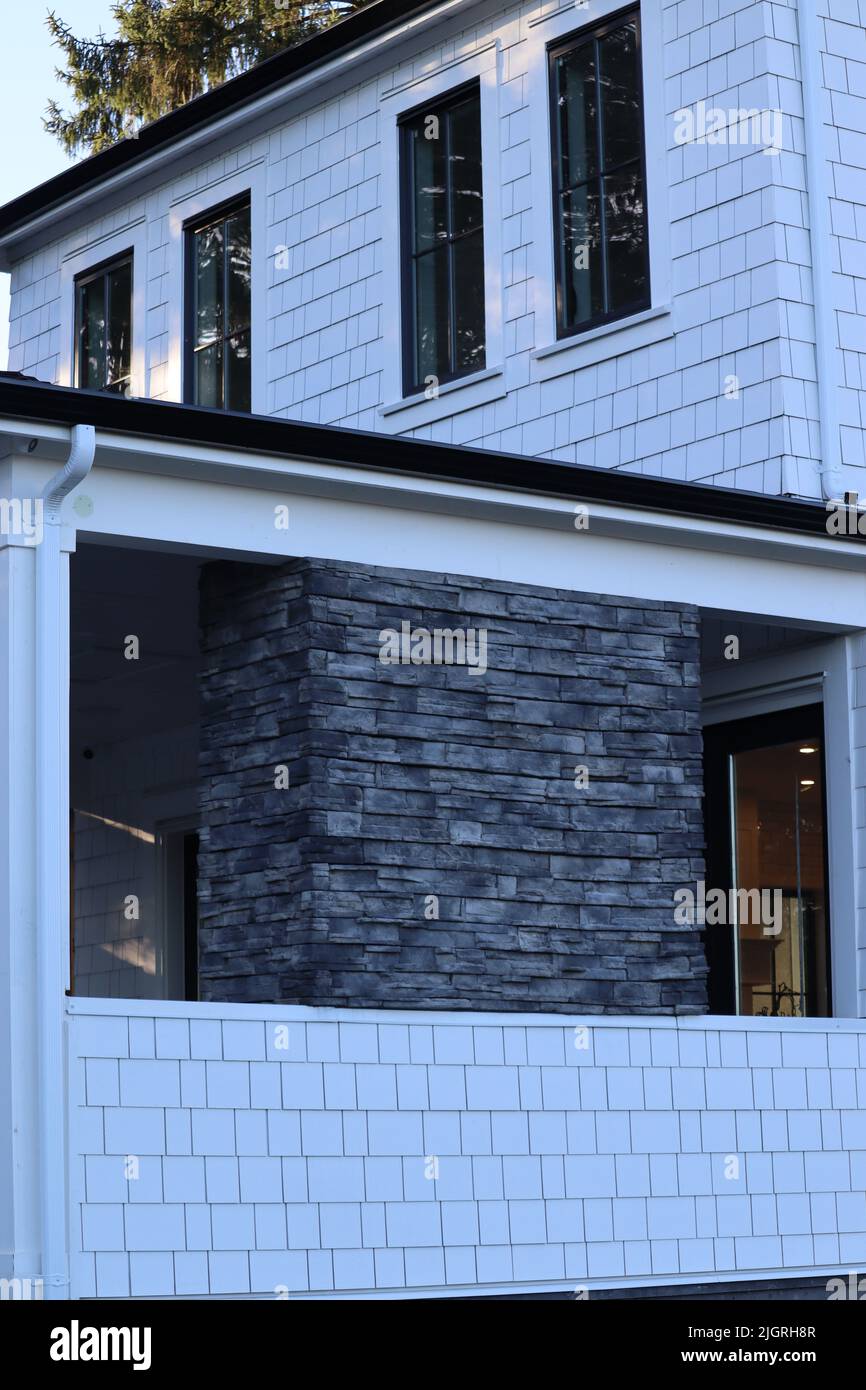 A low-angle view of modern houses in the background of sky Stock Photo ...