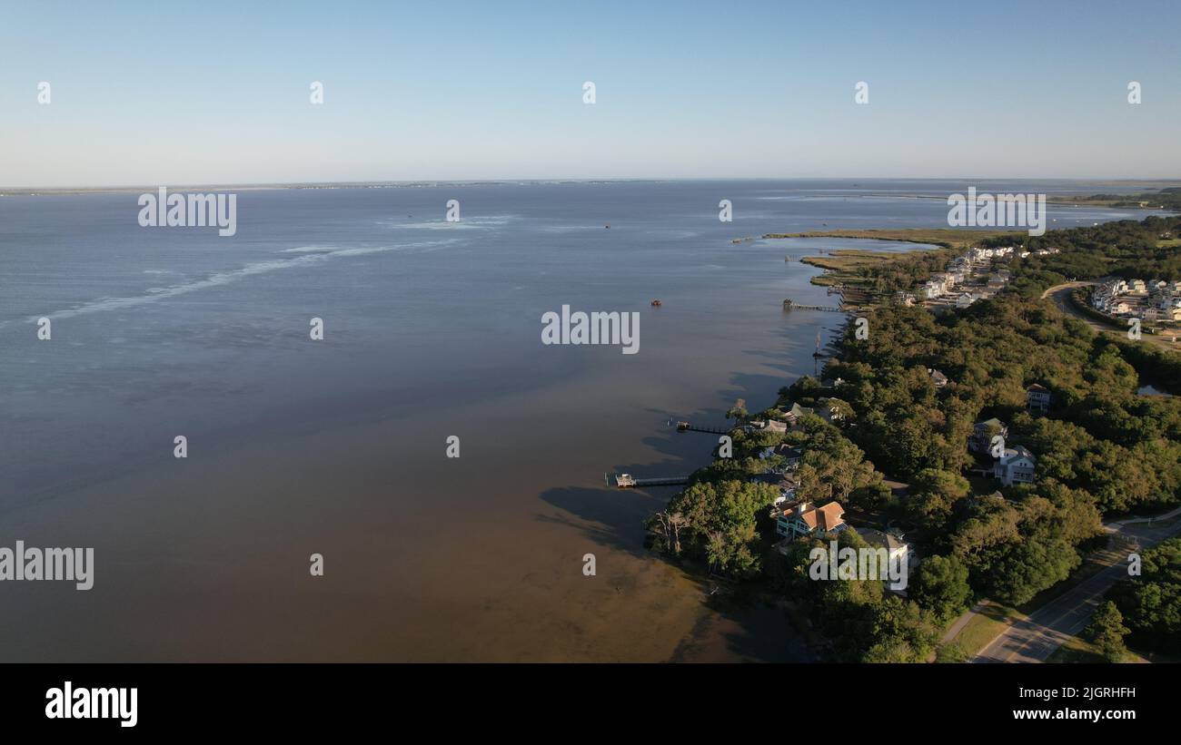 An aerial view of lush green Outer Banks island in North Carolina on ...