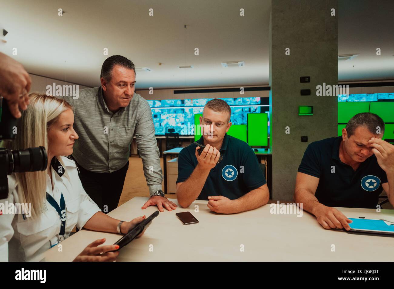 Group of security guards sitting and having briefing In the system ...