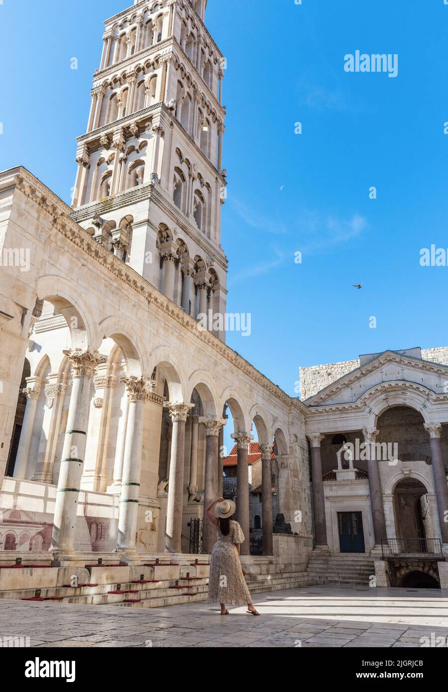 A Caucasian female standing on the peristyle of the Diocletian's Palace ...
