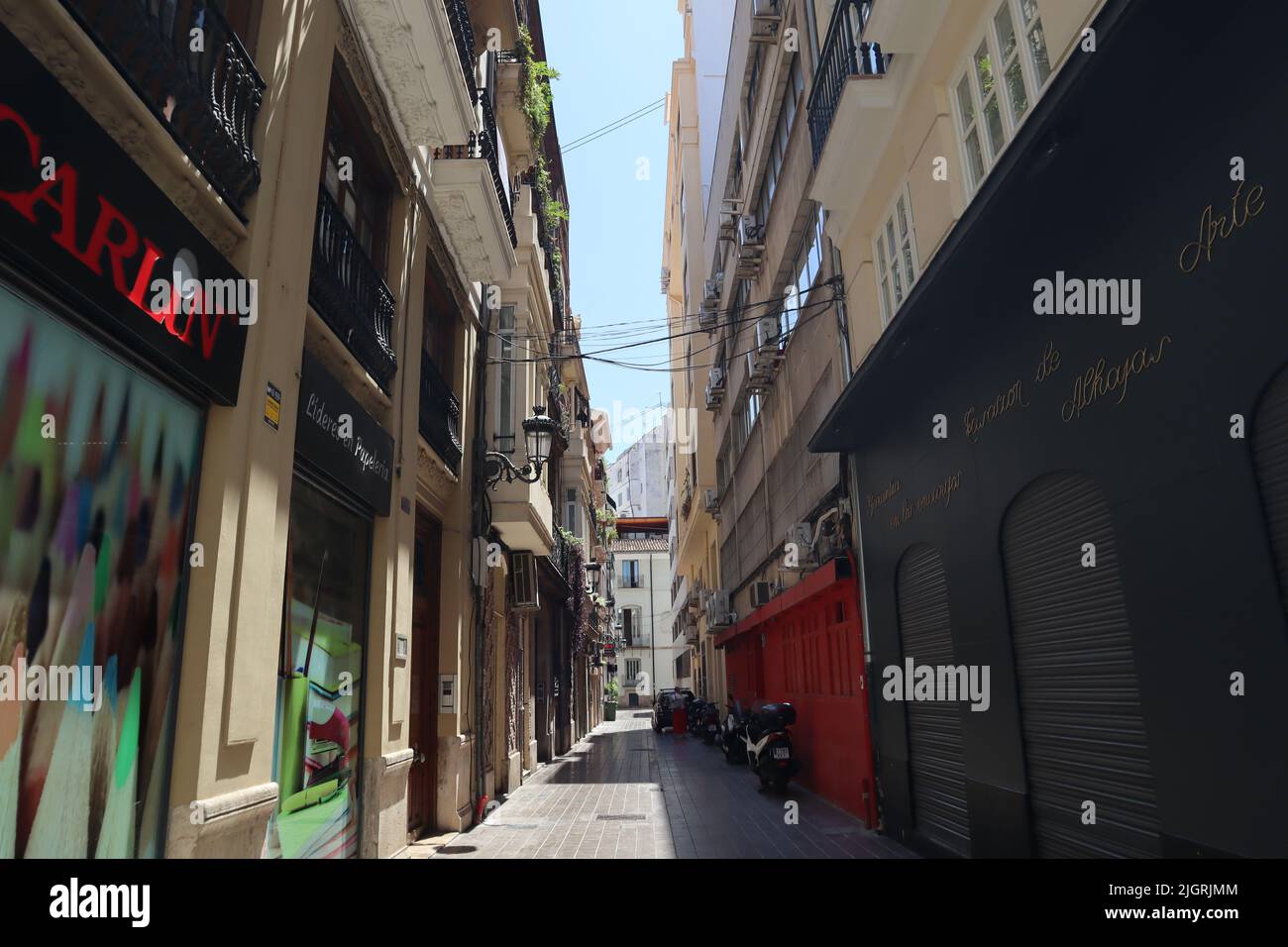 small street in a Spanish city with shops Stock Photo - Alamy
