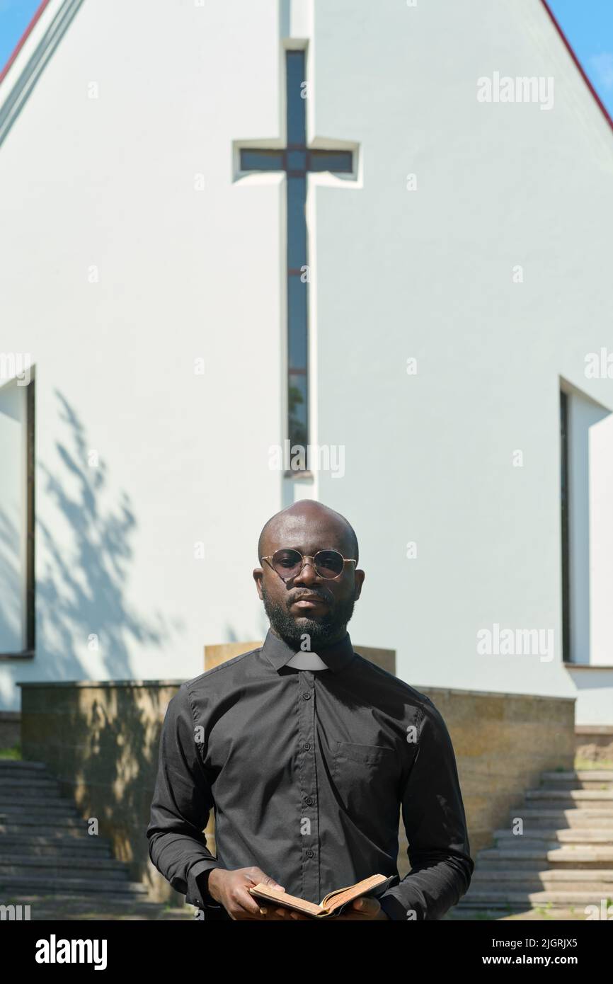Man in front of church building hi-res stock photography and images - Alamy