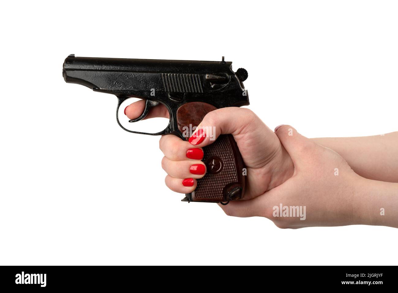 The woman is holding a gun in one hand while supporting her wrist with ...