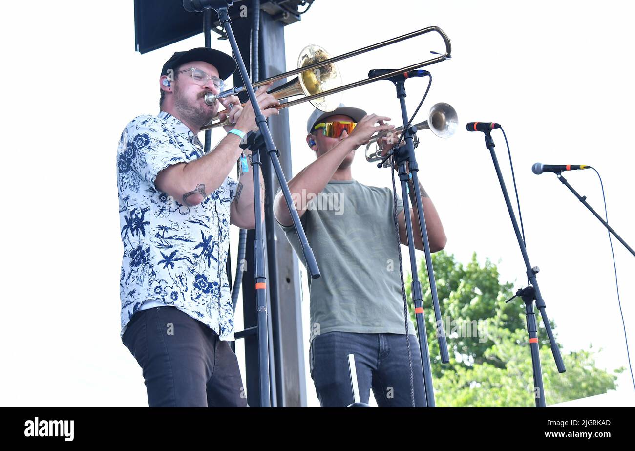 Tropidelic band members are shown performing on stage during a “live ...