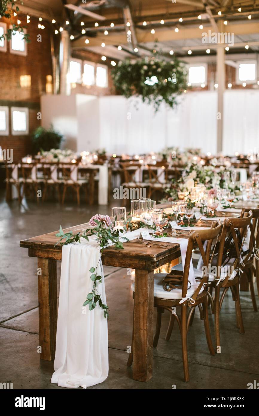 A wooden tables and chairs at a wedding reception Stock Photo - Alamy