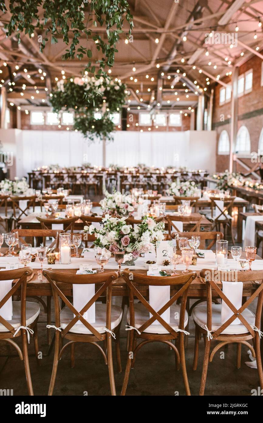 A wooden tables and chairs at a wedding reception Stock Photo - Alamy