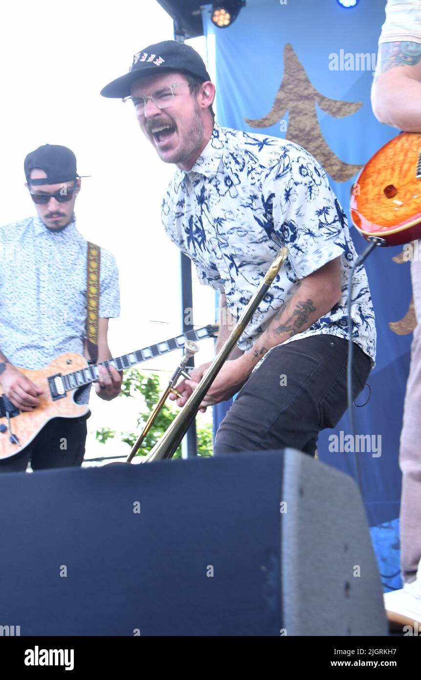 Singer and trombonist James Begin is shown performing on stage during a ...