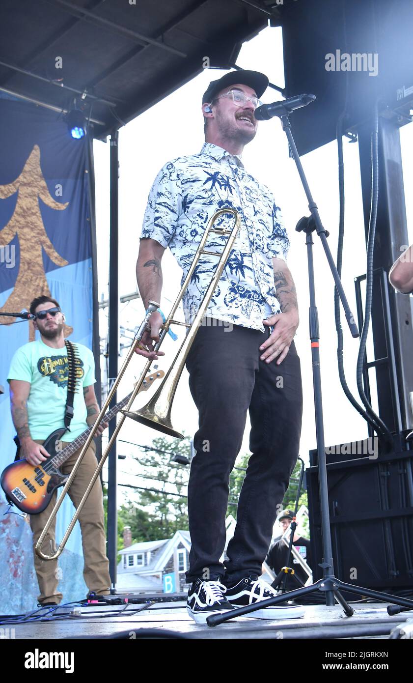 Singer and trombonist James Begin is shown performing on stage during a ...