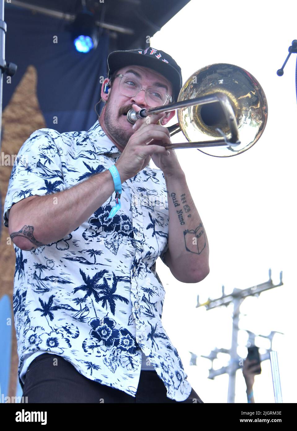 Singer and trombonist James Begin is shown performing on stage during a ...