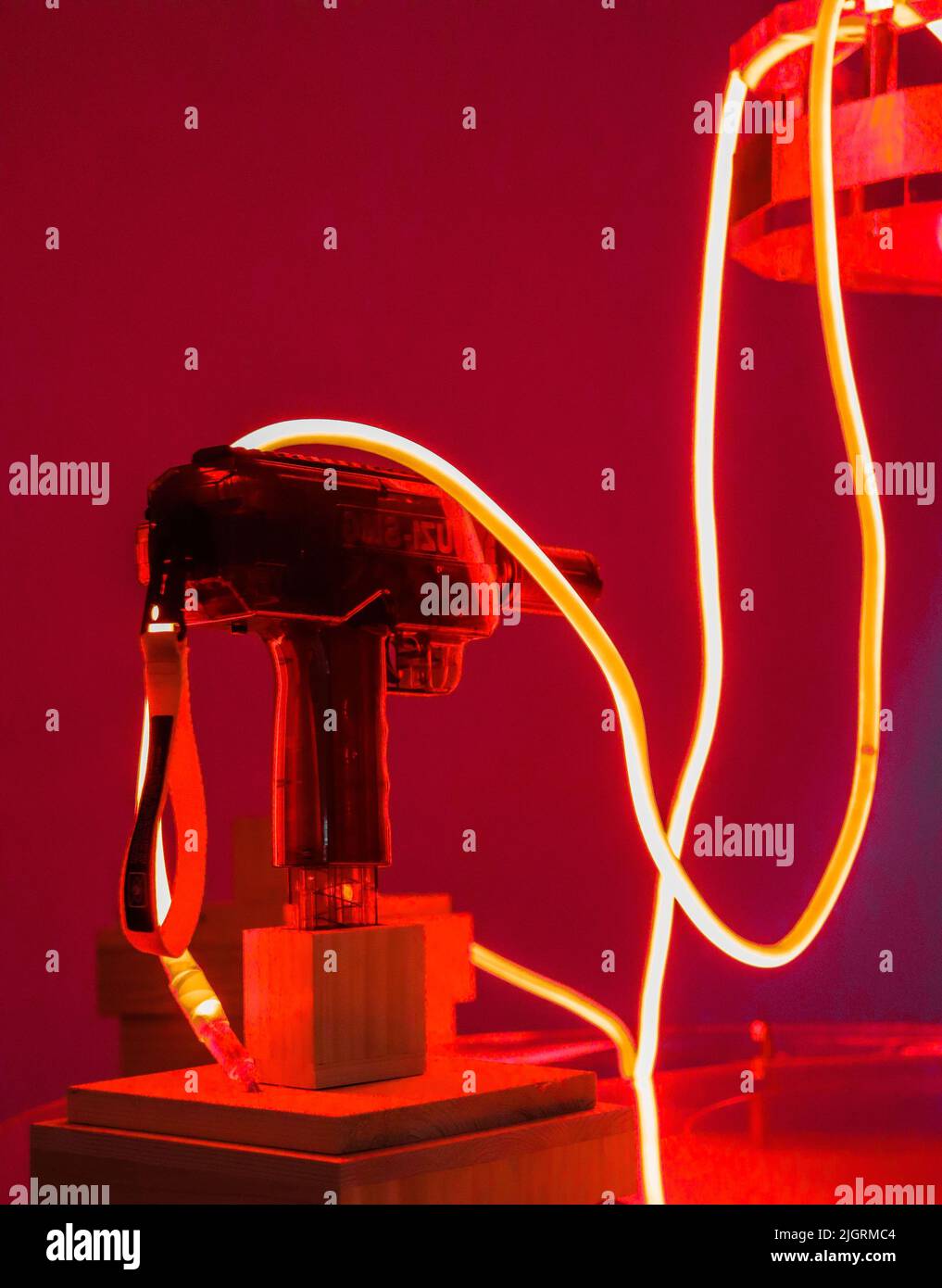 A vertical shot of a gun for VR games with red lights Stock Photo - Alamy