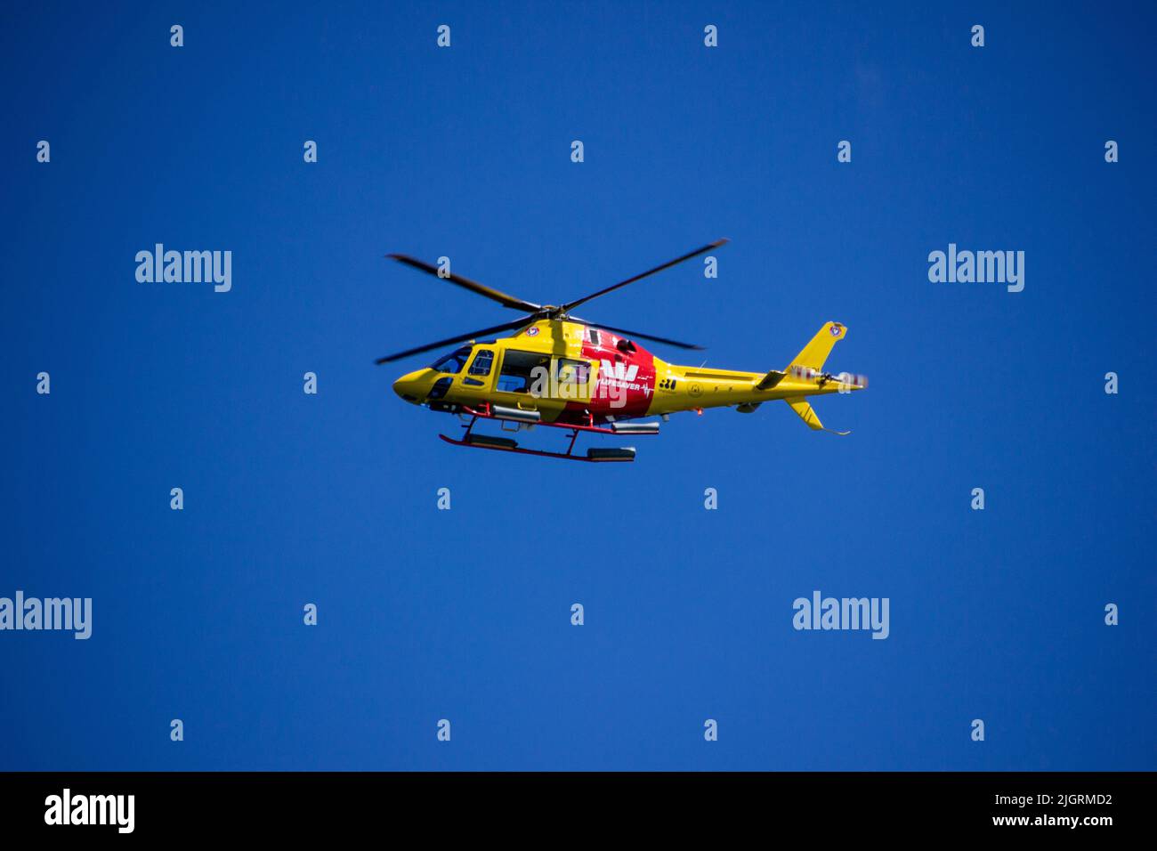 A Westpac Rescue Helicopter, shark spotting over the Back Beach in ...