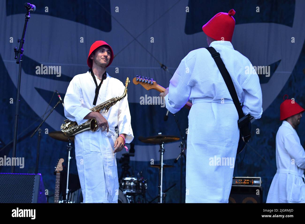 Vulfpeck band members are shown performing on stage during a “live ...