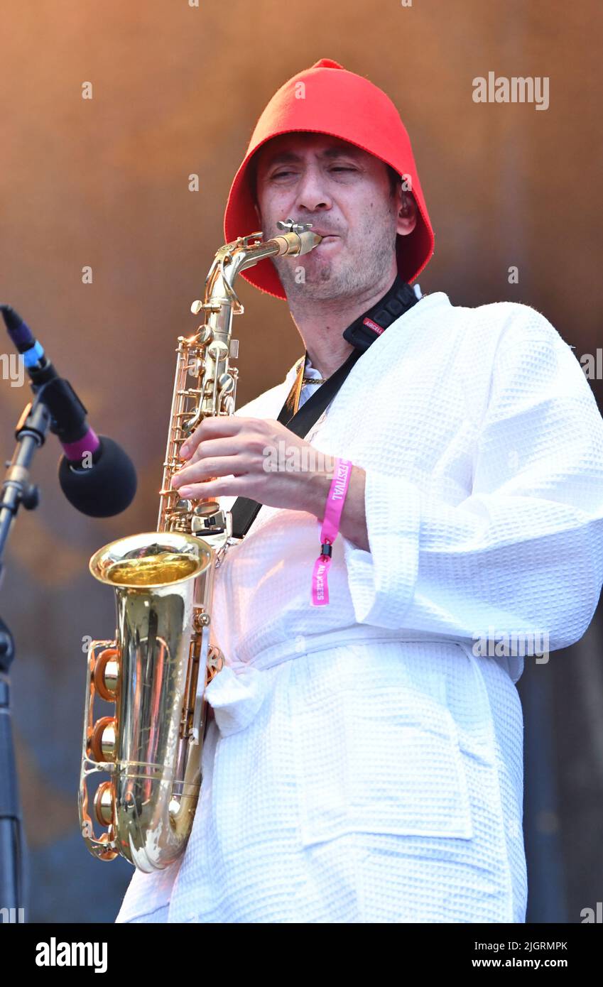 Vulfpeck band members are shown performing on stage during a “live ...