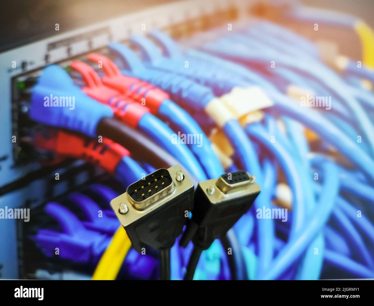 Both end of a VGA Cable (Male and Female) having nine pins In front of ...