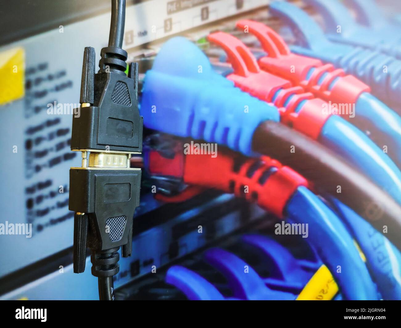 Both end of a VGA Cable (Male and Female) connected In front of a ...