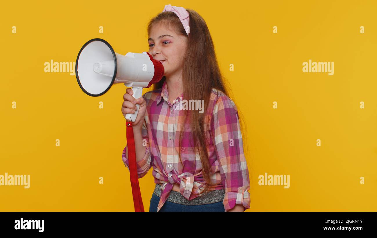 Preteen child girl kid talking with megaphone, proclaiming news, loudly ...