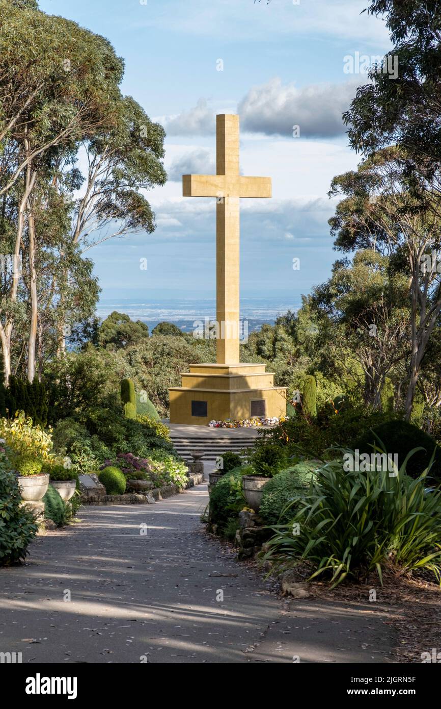 A vertical shot of a cross in the World War Two cemetery in Don Rak ...