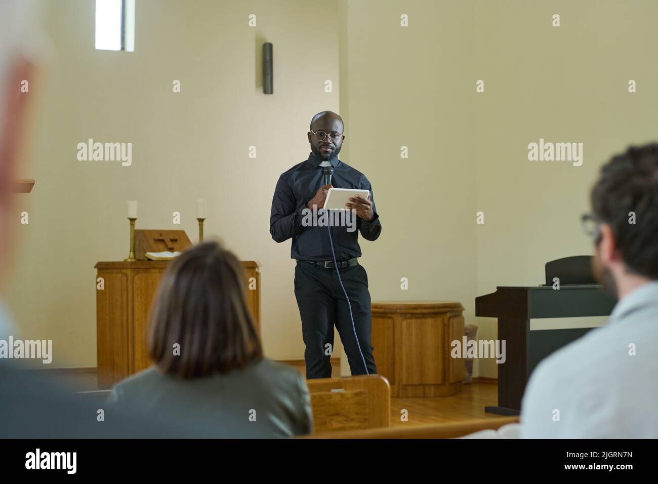 Black preacher microphone hi-res stock photography and images - Alamy