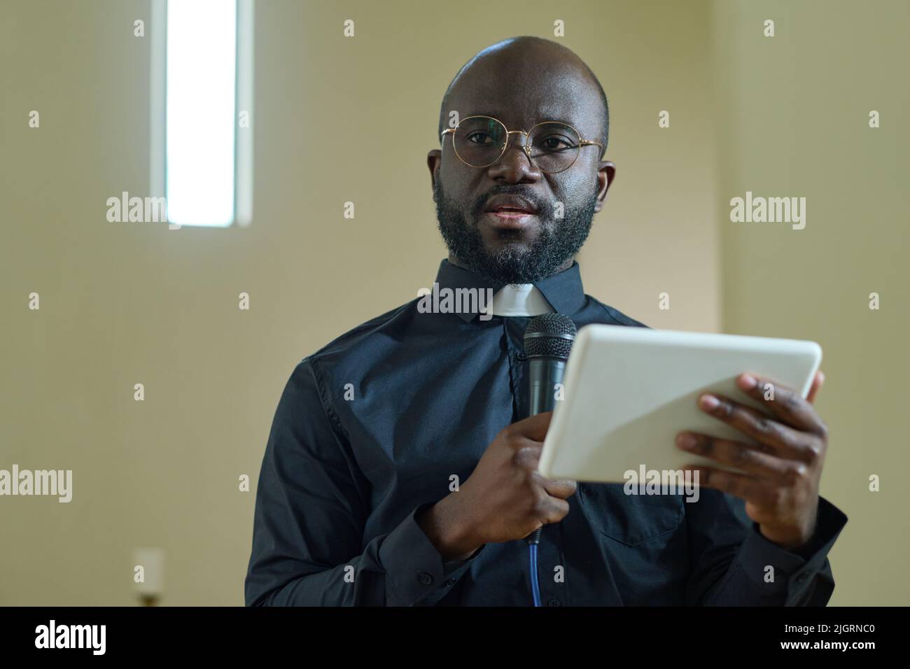 Black preacher microphone hi-res stock photography and images - Alamy