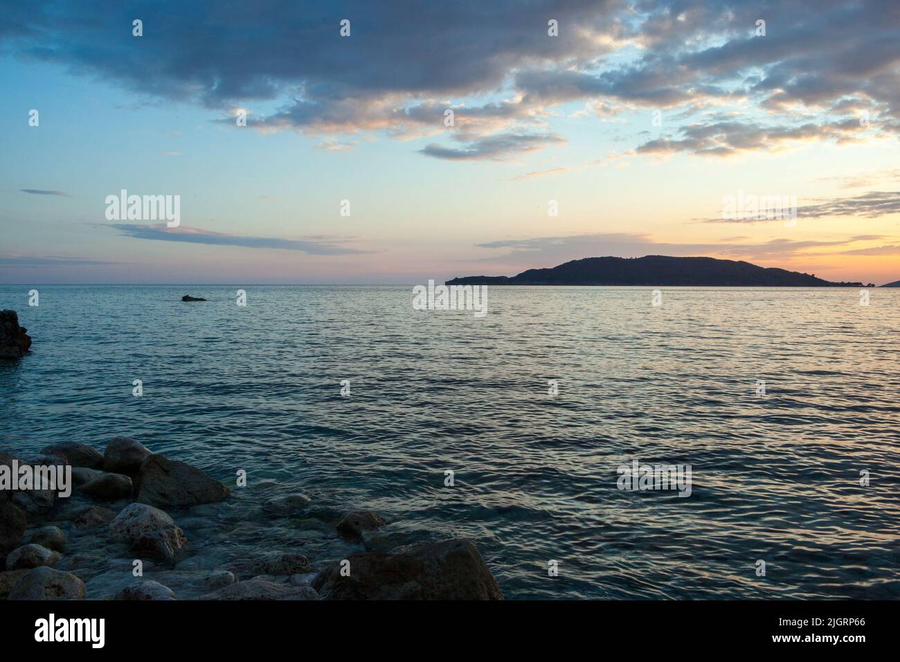Paradise seascape with stoney beach at sunset. Stone coastline with ...