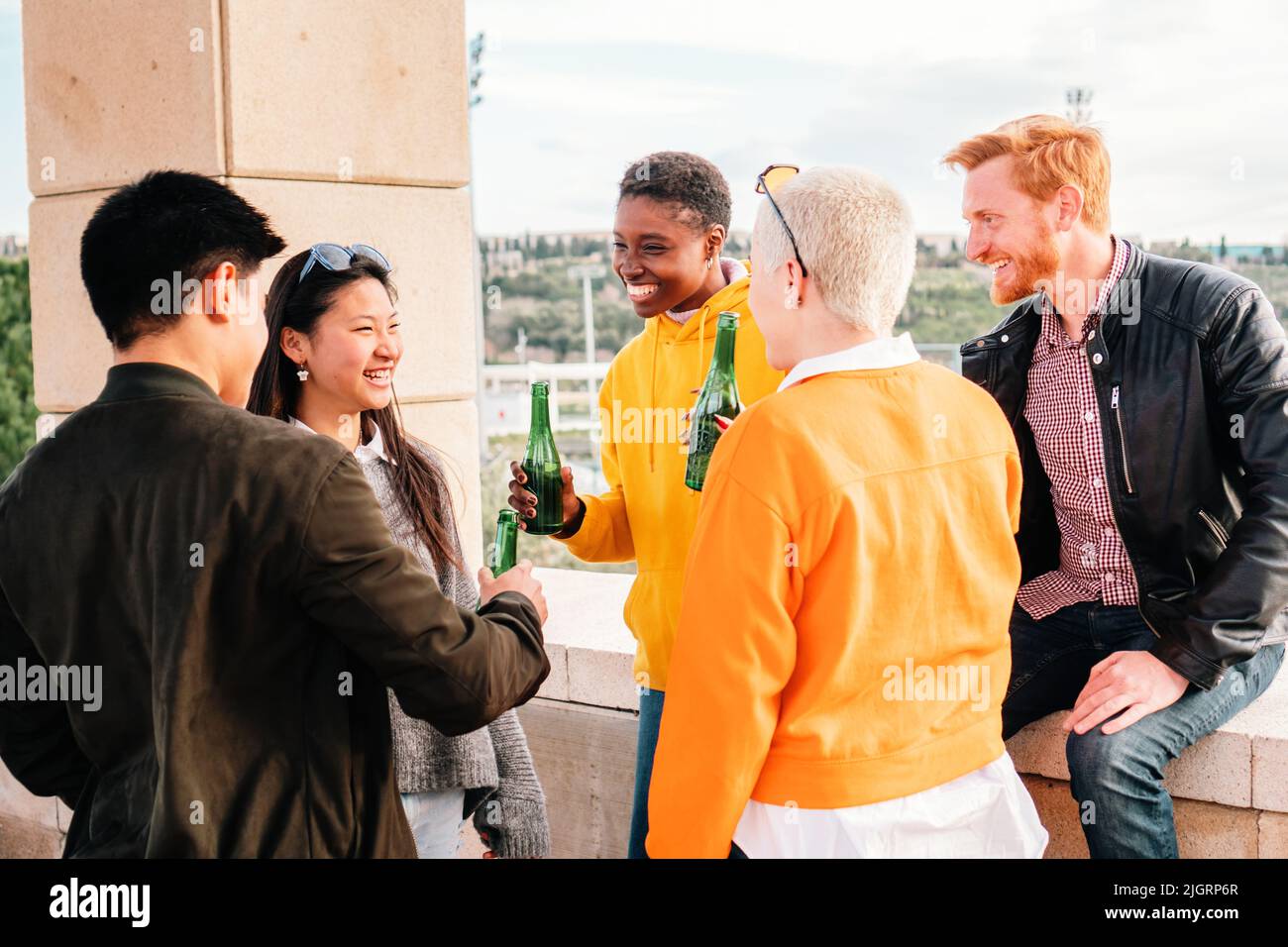 Young multi ethnic friends meeting drinking beers and having fun Stock ...