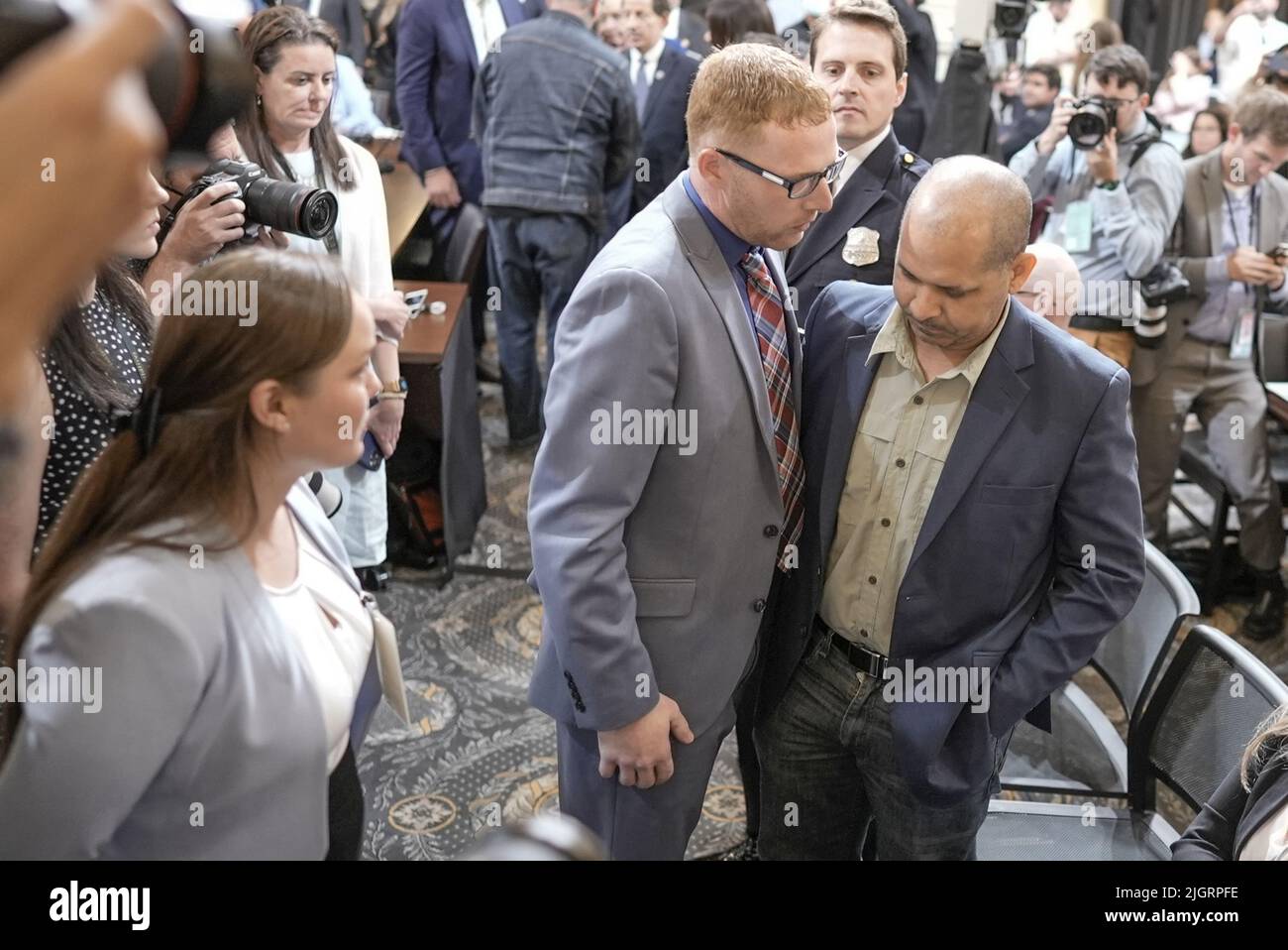 Washington, United States. 12th July, 2022. Stephen Ayres, center, who ...