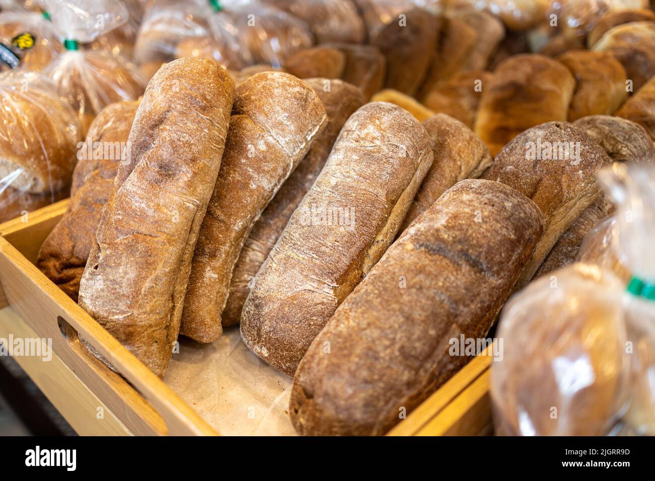 A variety of bread products with sesame: buns, pretzels, poppy seed ...