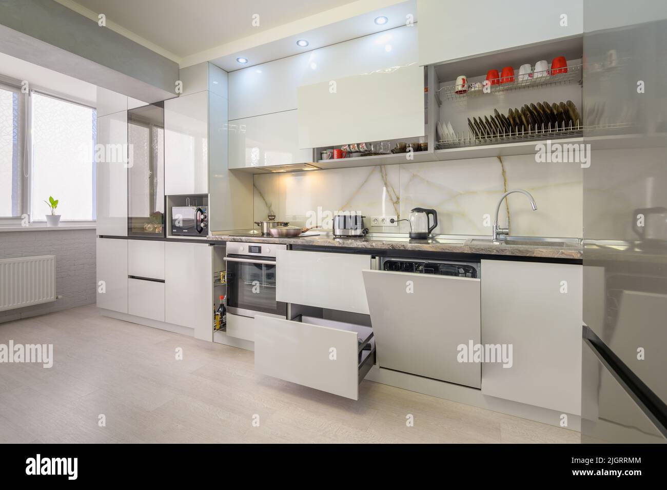 Interior of modern trendy white kitchen Stock Photo - Alamy