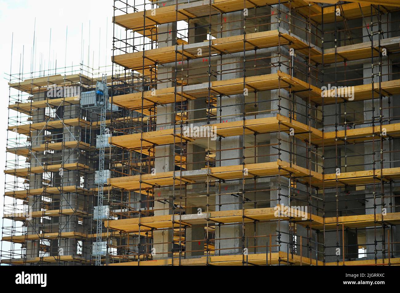 A construction site with huge scaffolding around the buildings Stock ...