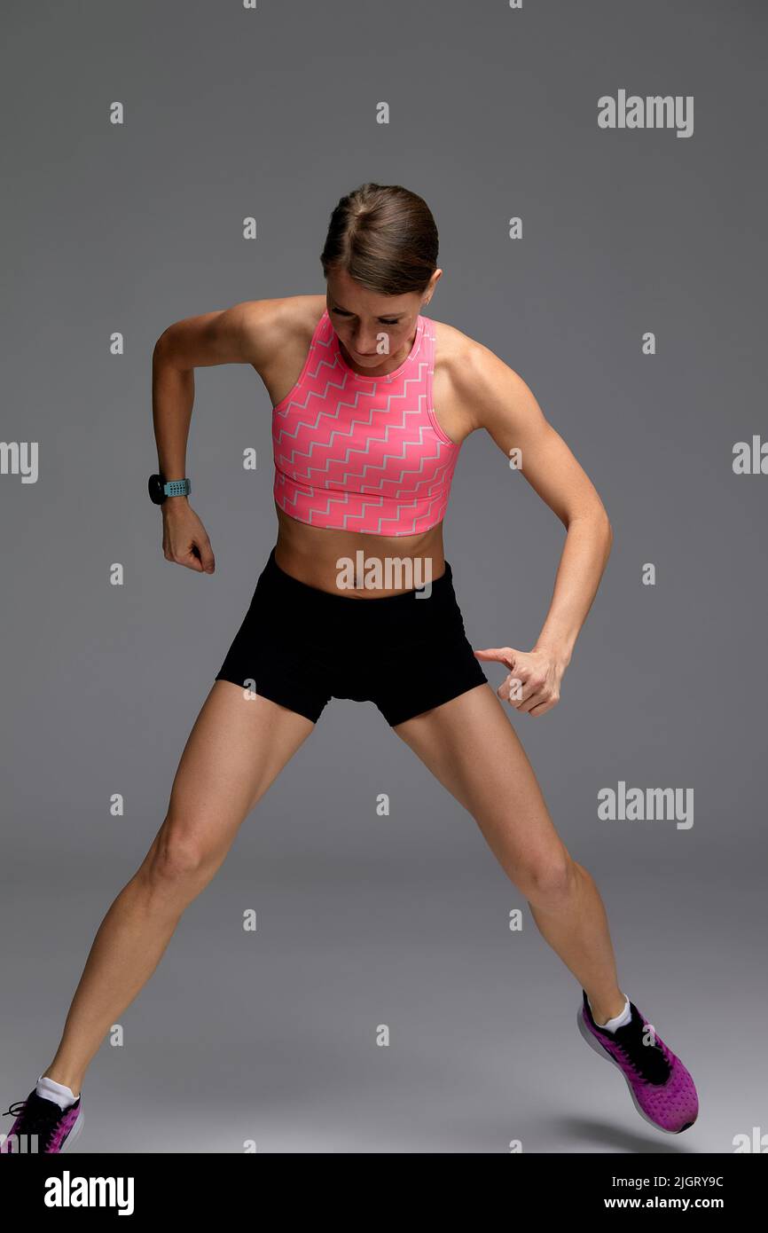 Fitness woman jumping and running, working out. Athletic girl doing ...