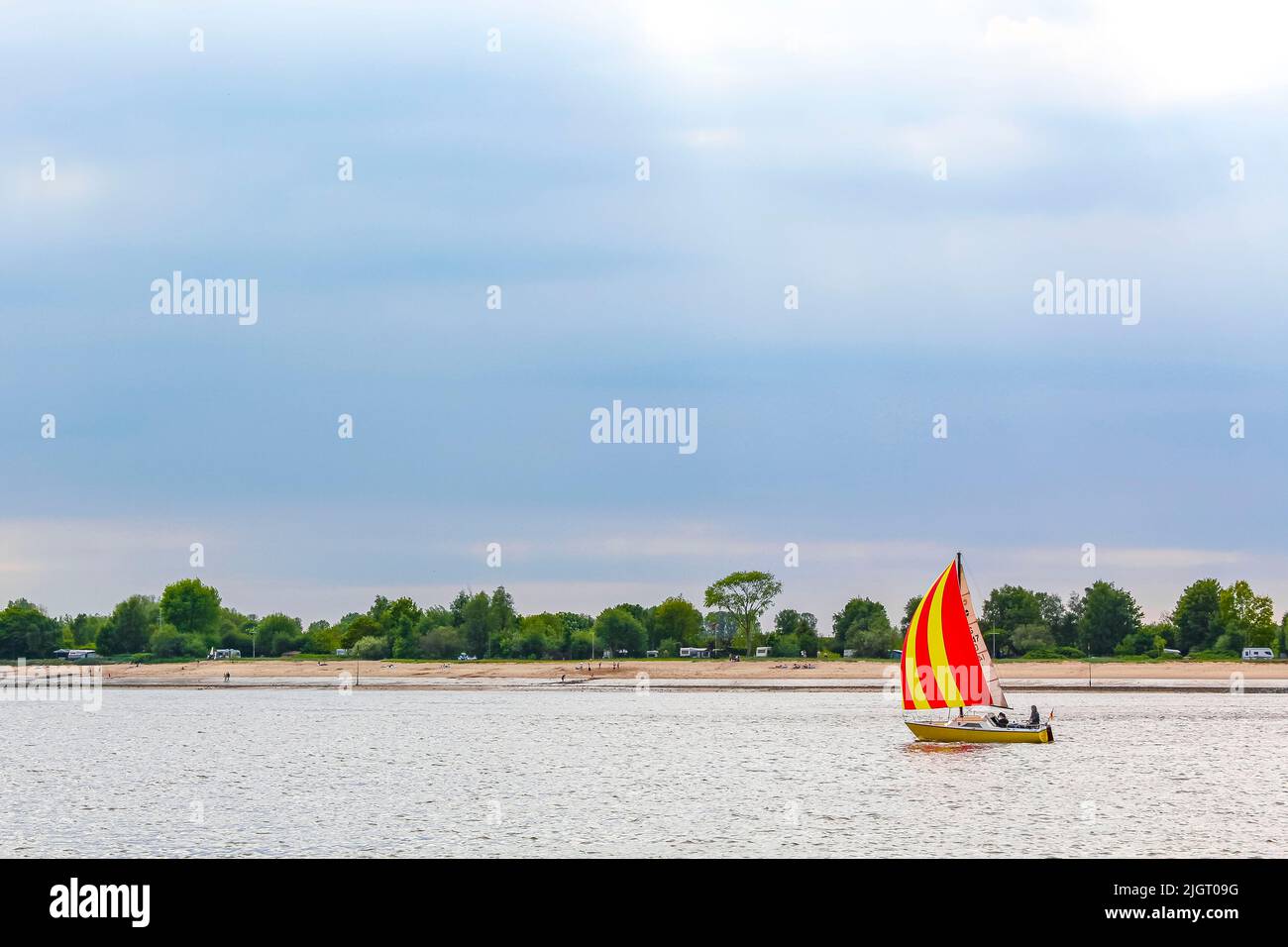 Boats at beautiful wadden sea tidelands coast beach water and dike ...