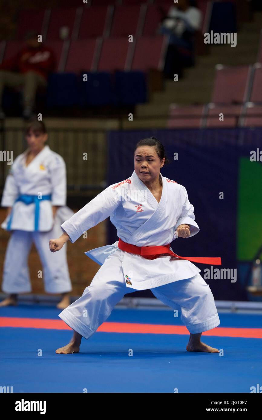 Alexandra Camacho Anacan from New Zealand performs a low punch during ...